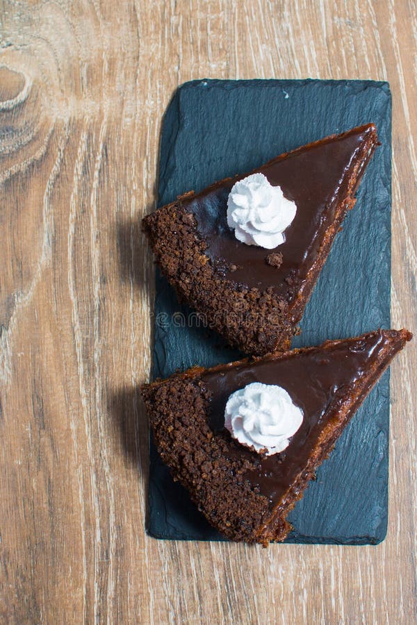 Two Pieces of Cake on a Stone Plate Stock Photo - Image of pastry ...