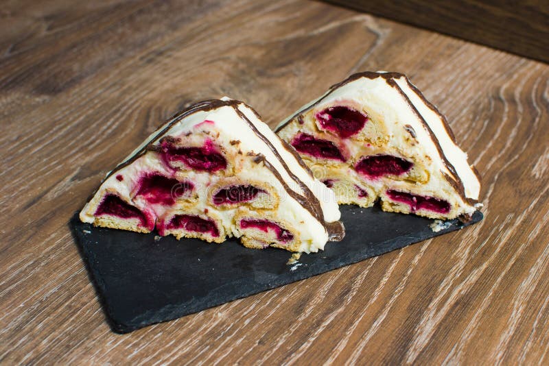 Two Pieces of Cake on a Stone Plate Stock Photo - Image of baking ...