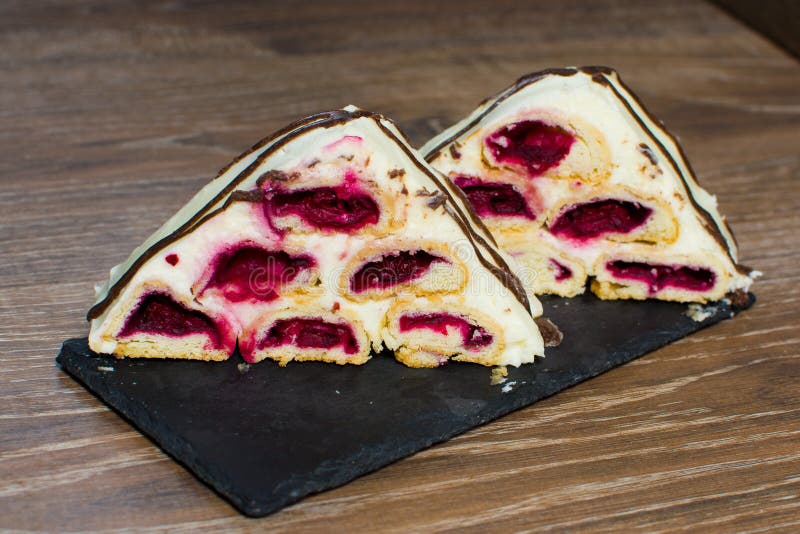 Two Pieces of Cake on a Stone Plate Stock Photo - Image of treat, piece ...