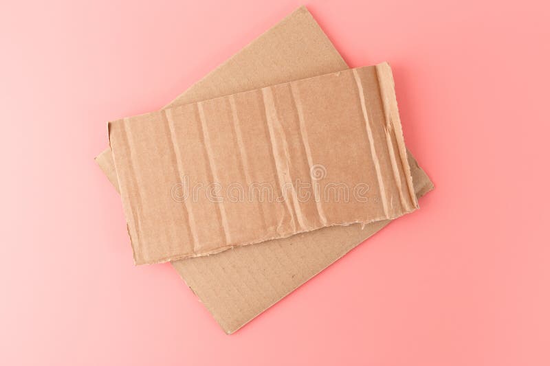 Two Pieces of Cardboard Placed on Pink Surface. Textured Material with ...