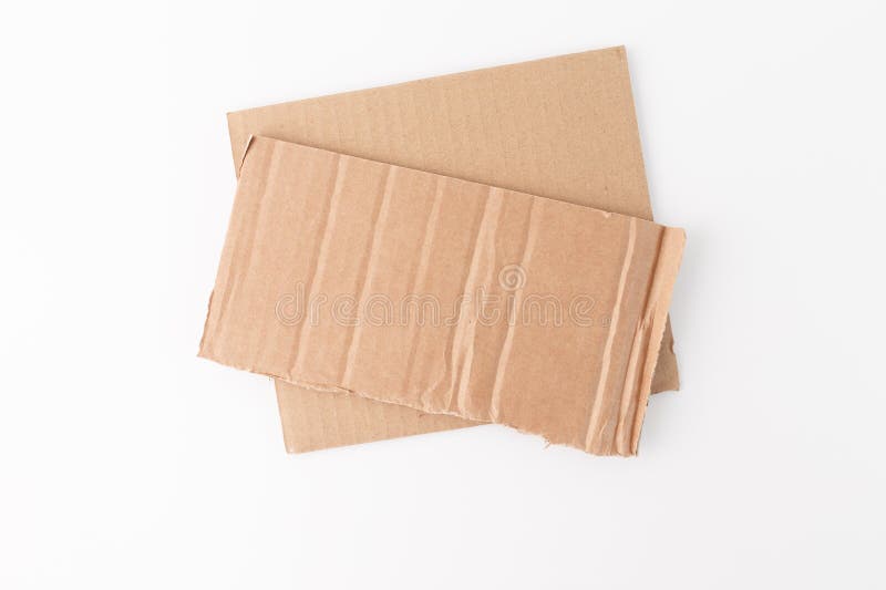 Two Pieces of Cardboard Placed on White Surface. Vertical Ridges and ...