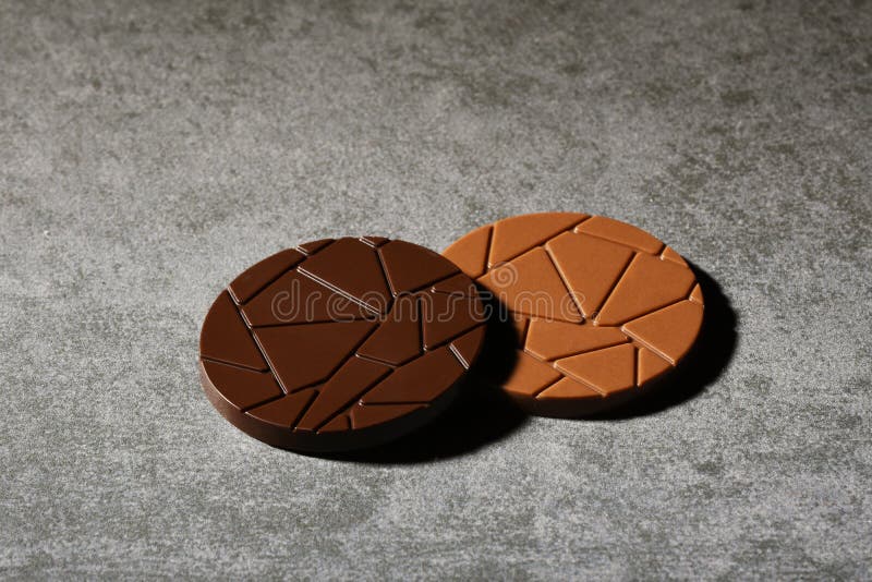 Two Pieces, Circle Shape Dark and Milk Chocolate on Gray Texture Stock ...