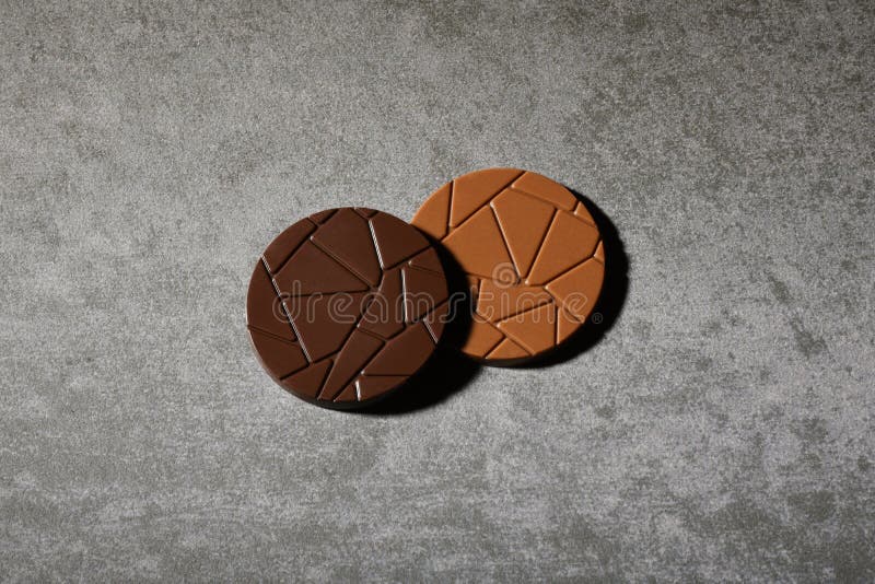 Two Pieces, Circle Shape Dark and Milk Chocolate on Gray Texture Stock ...