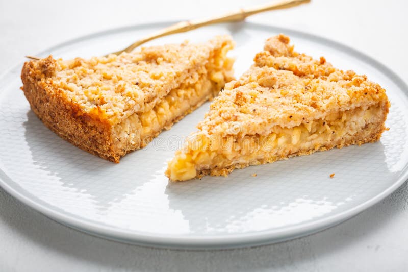 Two Pieces of Homemade Apple Pie with Nuts on a Plate Stock Photo ...