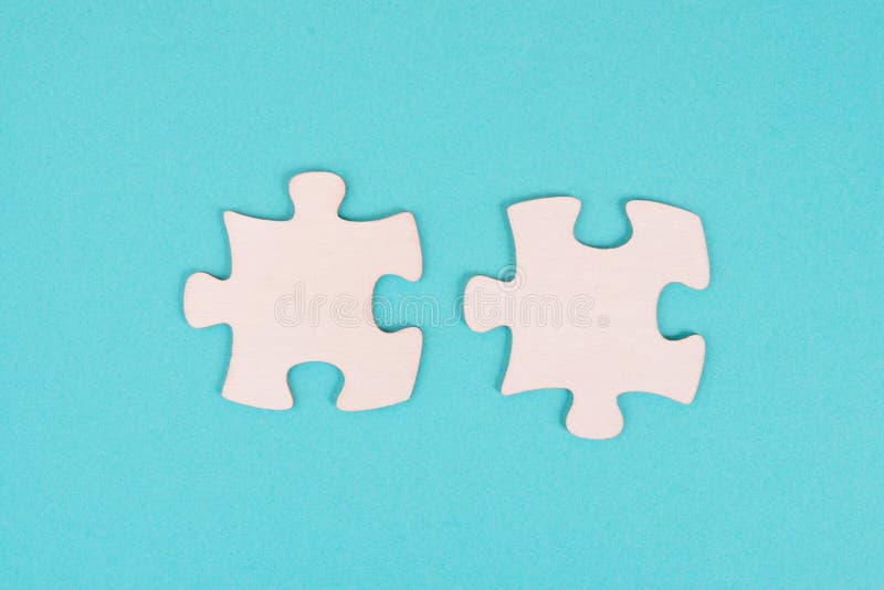 Two Pieces of a Puzzle, Connecting Together As a Team, Solving a ...