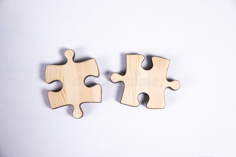 Two pieces of the puzzle stock photo. Image of pattern - 216695208