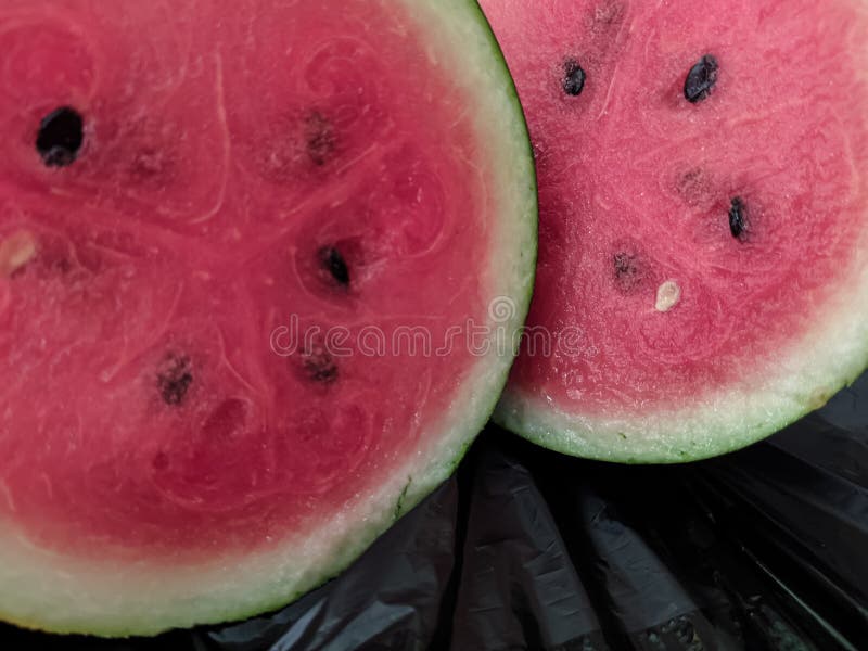 Two Pieces of Red Watermelon with Black Seed Stock Photo - Image of ...