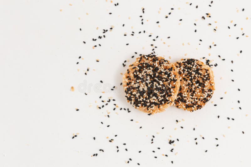 Two Pieces of Rice Cracker Mixed Grains Topping with Black Sesame Seed ...