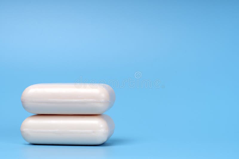 Two Pieces of Soap on a Blue Background, Front View Stock Image - Image ...