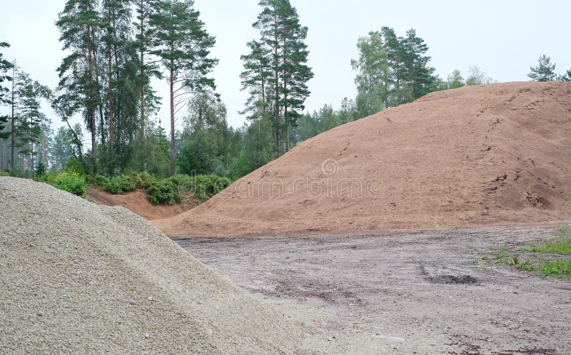 Two Piles of Dirt, Gravel, and Rocks, Resting Side-by-side on a Dirt ...