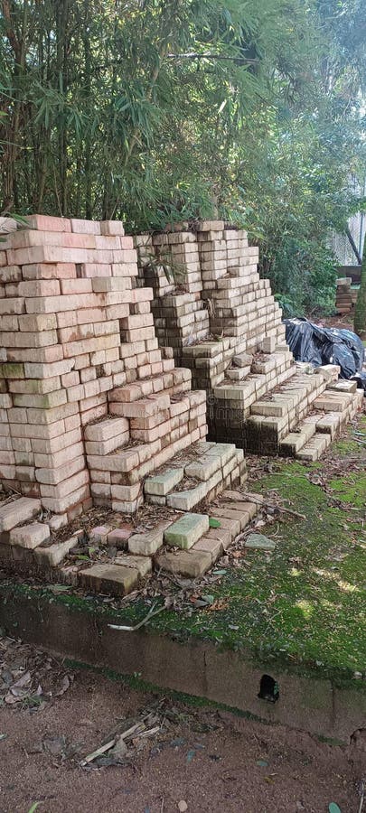 Two Piles of Old Bricks with Garbage Bag in the Background Stock Photo ...