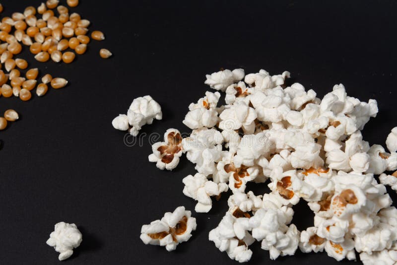 Two Piles of Popcorn, One Pile of Ready Popcorn, Another with Corn ...