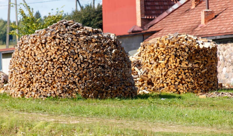 Two Piles of Wood Stacked in a Yard Stock Photo - Image of tree, lumber ...