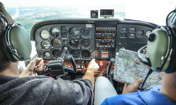 Two pilots flying stock photo. Image of c172, controls - 57328396