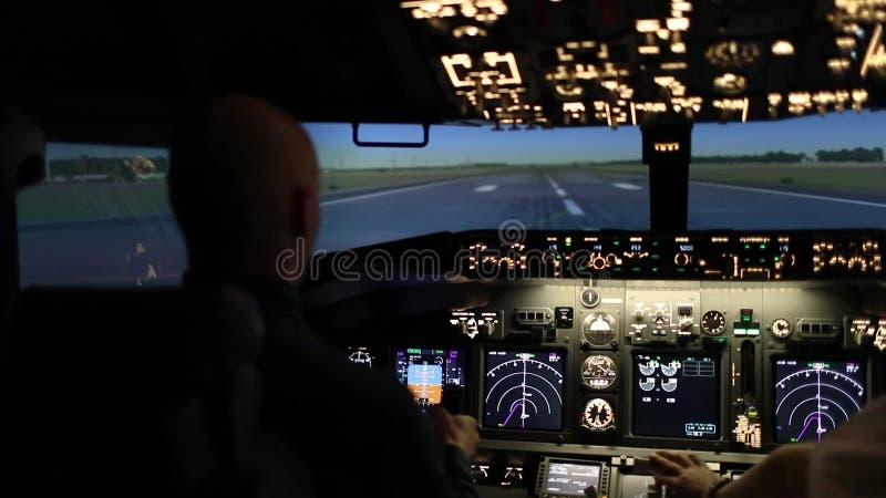 Two Pilots are Preparing To Take Off and Control the Aircraft in the ...