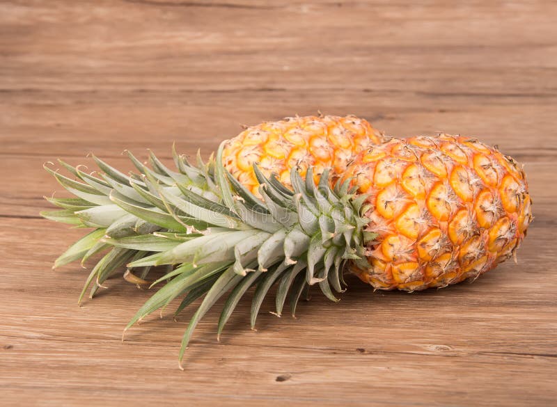 Two Pineapples on wood stock photo. Image of remove, brochure - 56583018