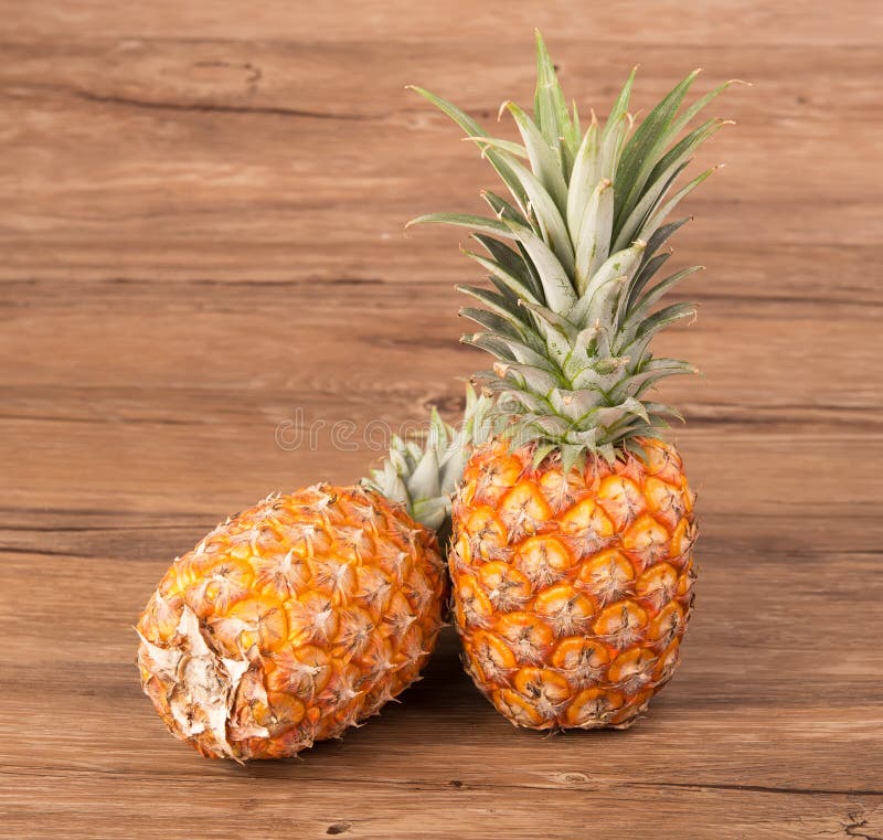 Two Pineapples on wood stock image. Image of diet, brochure - 56583027