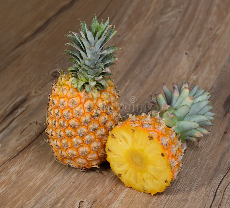 Two Pineapples on Wooden Background Stock Photo - Image of background ...