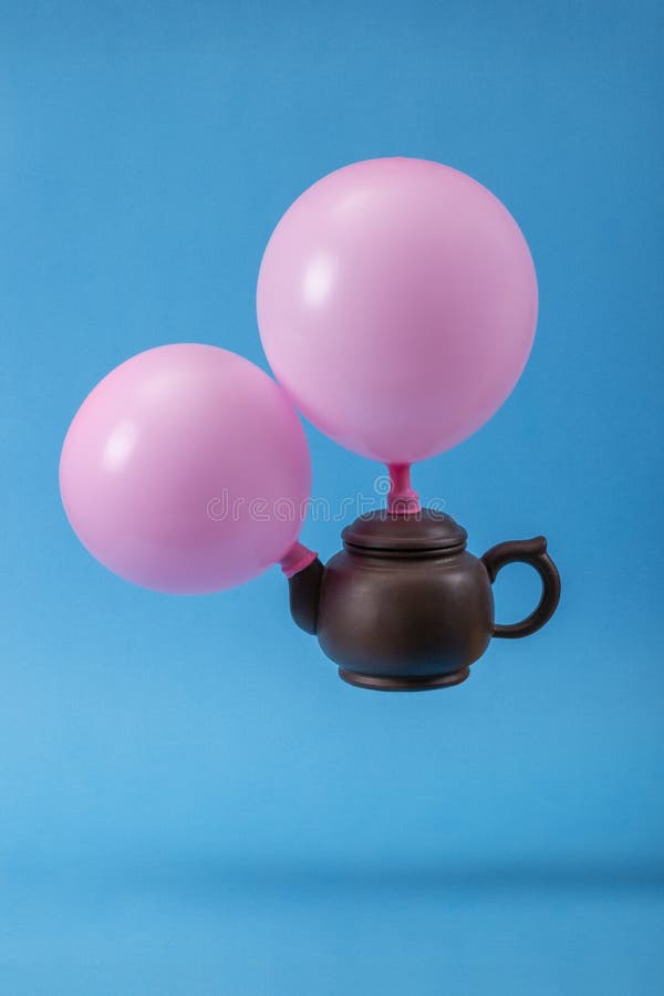 Two Pink Balloons on a Teapot on a Blue Background Stock Photo - Image ...