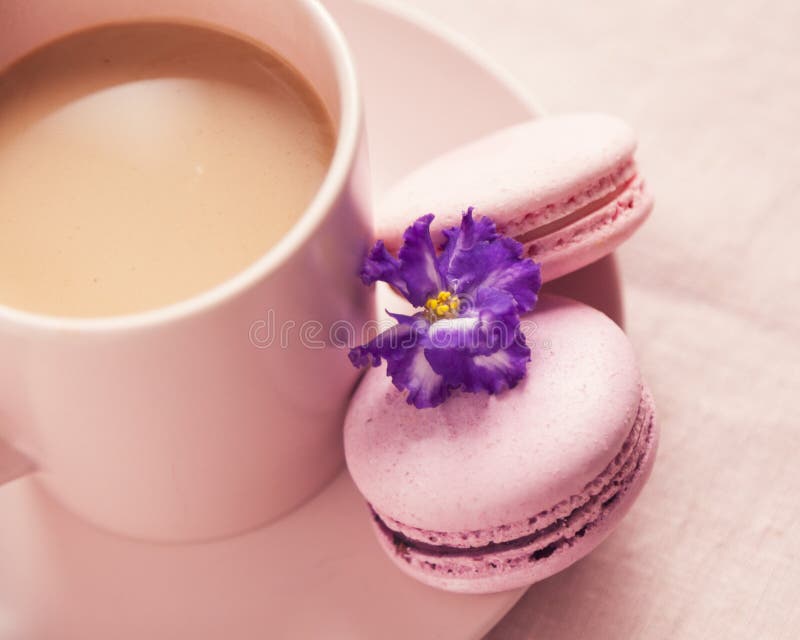 Two Pink Macaroons on the Plate Near Cup with Coffee Stock Photo ...