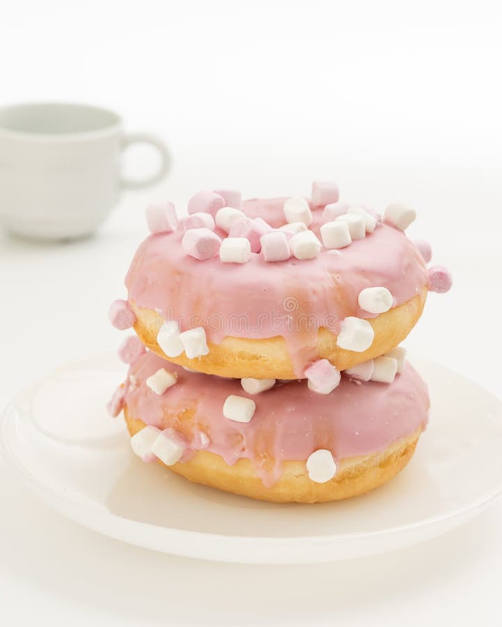 Two Pink Marshmellow Donuts on a Plate for Breakfast Stock Image ...