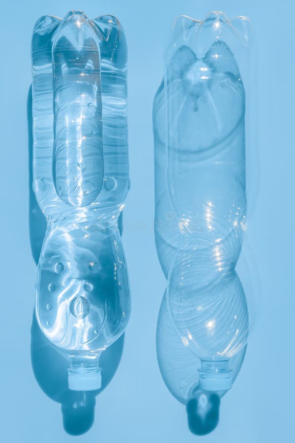 Two Plastic Bottles on a Blue Background. Stock Image - Image of fresh ...