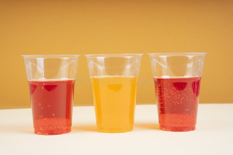 Two Plastic Red Sparkling Soda Water Cup and Orange Stock Photo - Image ...