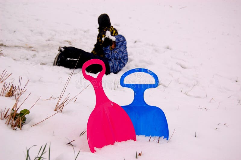 Two Plastic Sledges in the Snow Stock Image - Image of snowing, frost ...