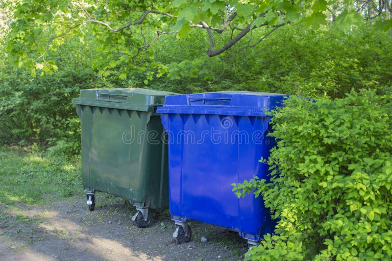 Two Plastic Trash Containers. the Containers are Located in the City ...