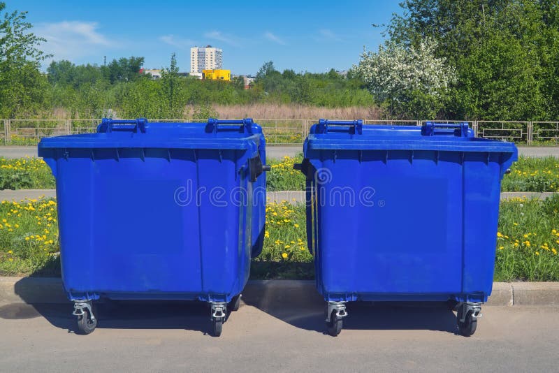 Two Plastic Trash Recycling Containers. Blue Containers for Collecting ...