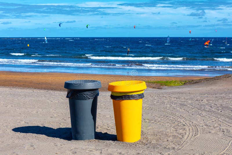 Two Plastic Waste Bins on the Sandy Beach Stock Image - Image of ...