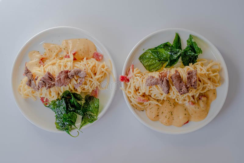 Two Plates of Rose Pasta Spaghetti Stock Image - Image of traditional ...