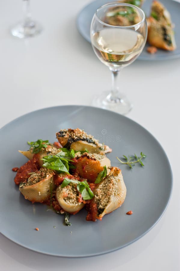 Two plates of shells pasta stock image. Image of cheese - 41001755