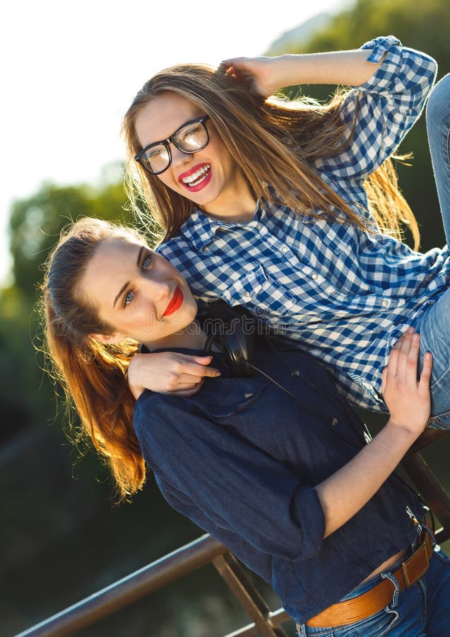 Two Playful Young Women Having Fun Outdoors Stock Photo - Image of ...