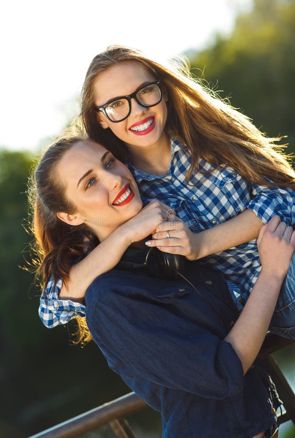 Two Playful Young Women Having Fun Outdoors Stock Image - Image of ...