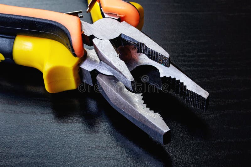 Two Pliers, Tools on a Wooden Table Stock Image - Image of pliers ...