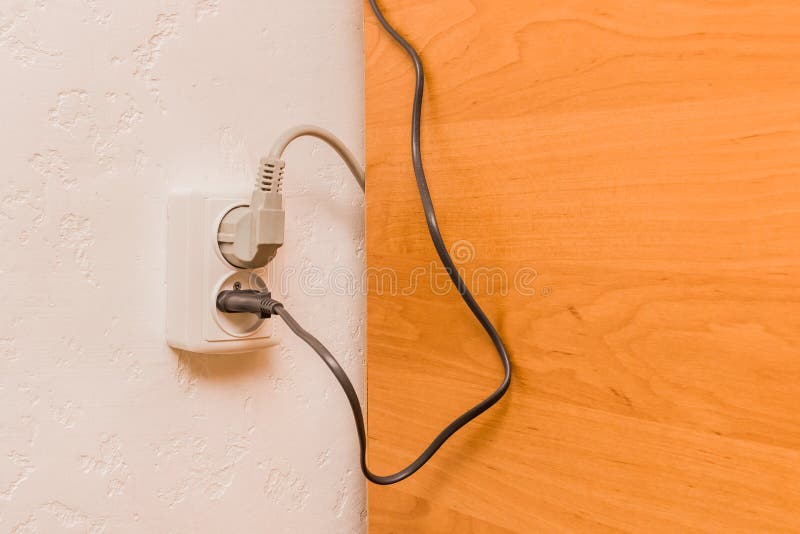 Two Plugs in the Socket in a Modern Interior. Safe Connection of ...