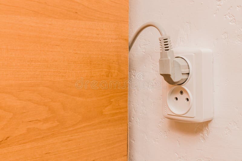 Two Plugs in the Socket in a Modern Interior. Safe Connection of ...