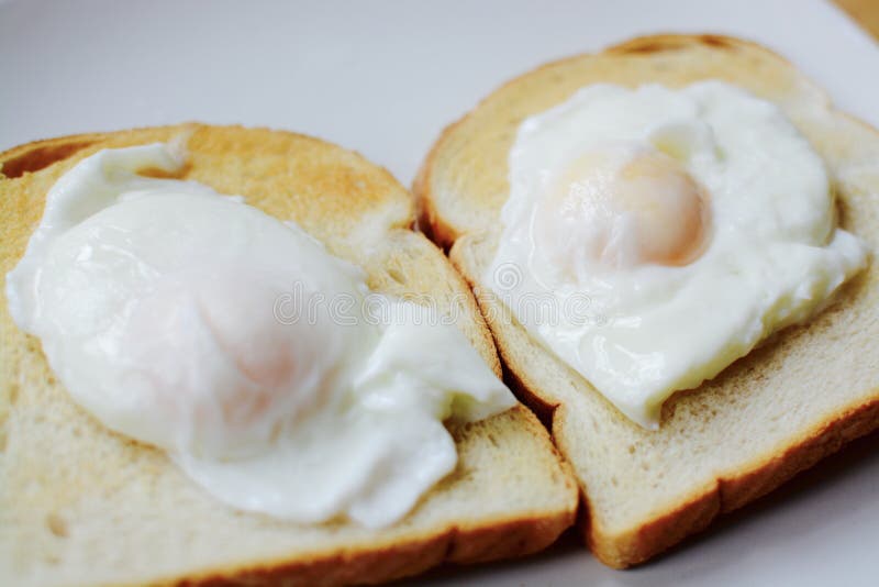 Poached eggs on toast stock photo. Image of yolk, unbuttered - 121560338