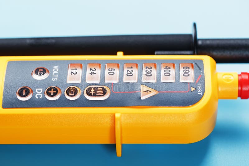 Two-pole Voltage Indicator Close-up on a Blue Background. Stock Image ...
