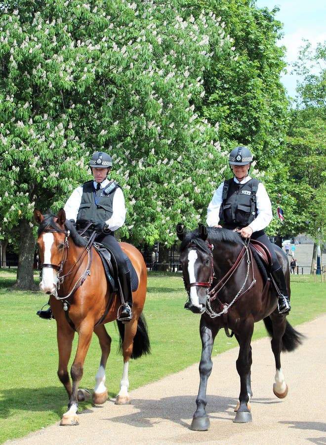 Two Police Officers on Horses Editorial Stock Image - Image of park ...
