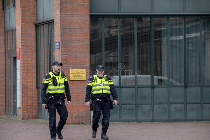 Two Policemen Walking at Amsterdam the Netherlands 25-2-2025 Editorial ...