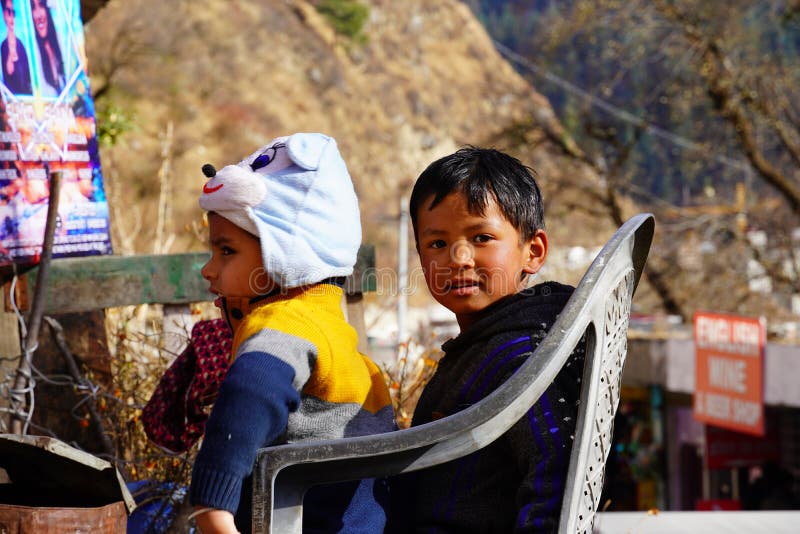 Two Poor Kids Sitting on Chair Image Editorial Stock Photo - Image of ...