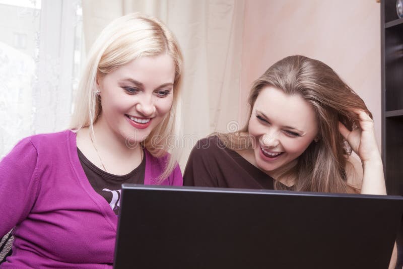 Two Positive Winsome Caucaisan Girlfriends Having Fun while Working ...