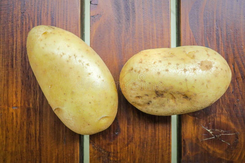 Two Potatoes on the Wood Table Stock Photo - Image of healthy ...