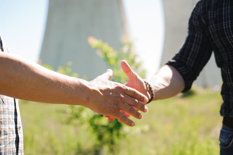 Two Power Line Tower Workers with Handshaking. Stock Photo - Image of ...