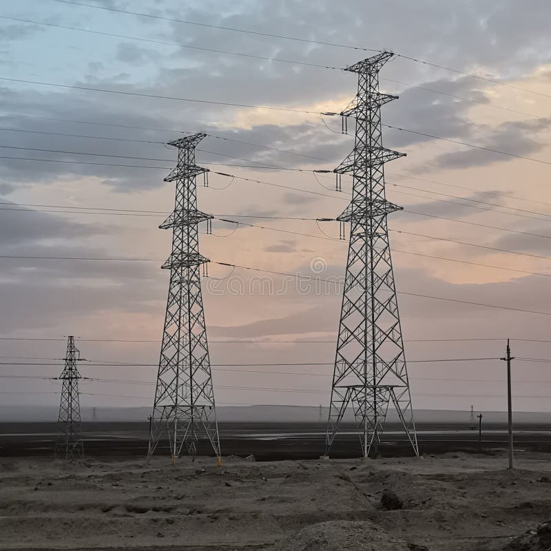 Two power towers stock photo. Image of windmill, power - 222270008