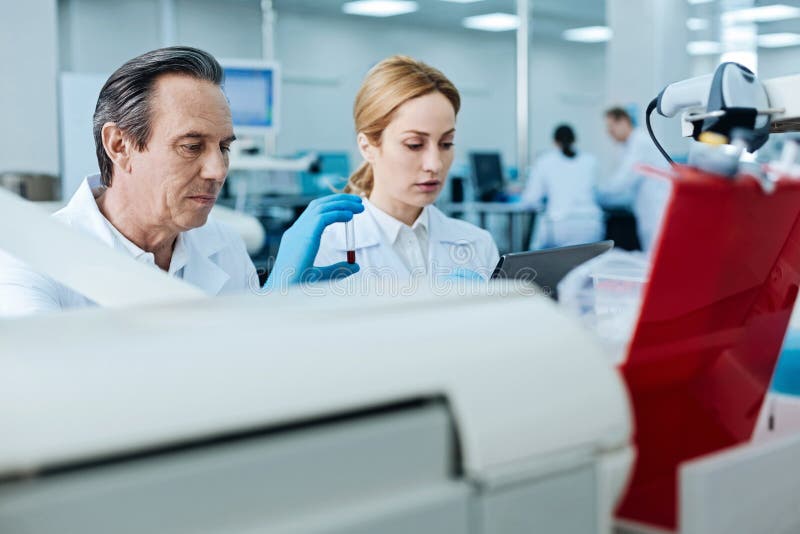 Two Practitioners Working Together in the Lab Stock Image - Image of ...