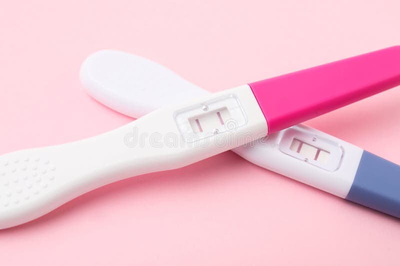 Two Pregnancy Tests on Pink Background, Closeup Stock Image - Image of ...