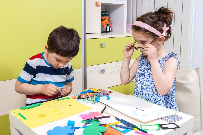 Two Preschool Child Create a Picture with Shapes Stock Image - Image of ...